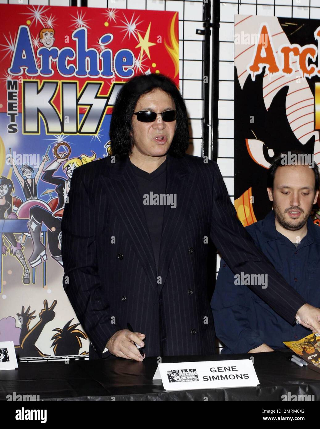Gene Simmons and Paul Stanley sign copies of "Archie Meets Kiss Part 1 ...