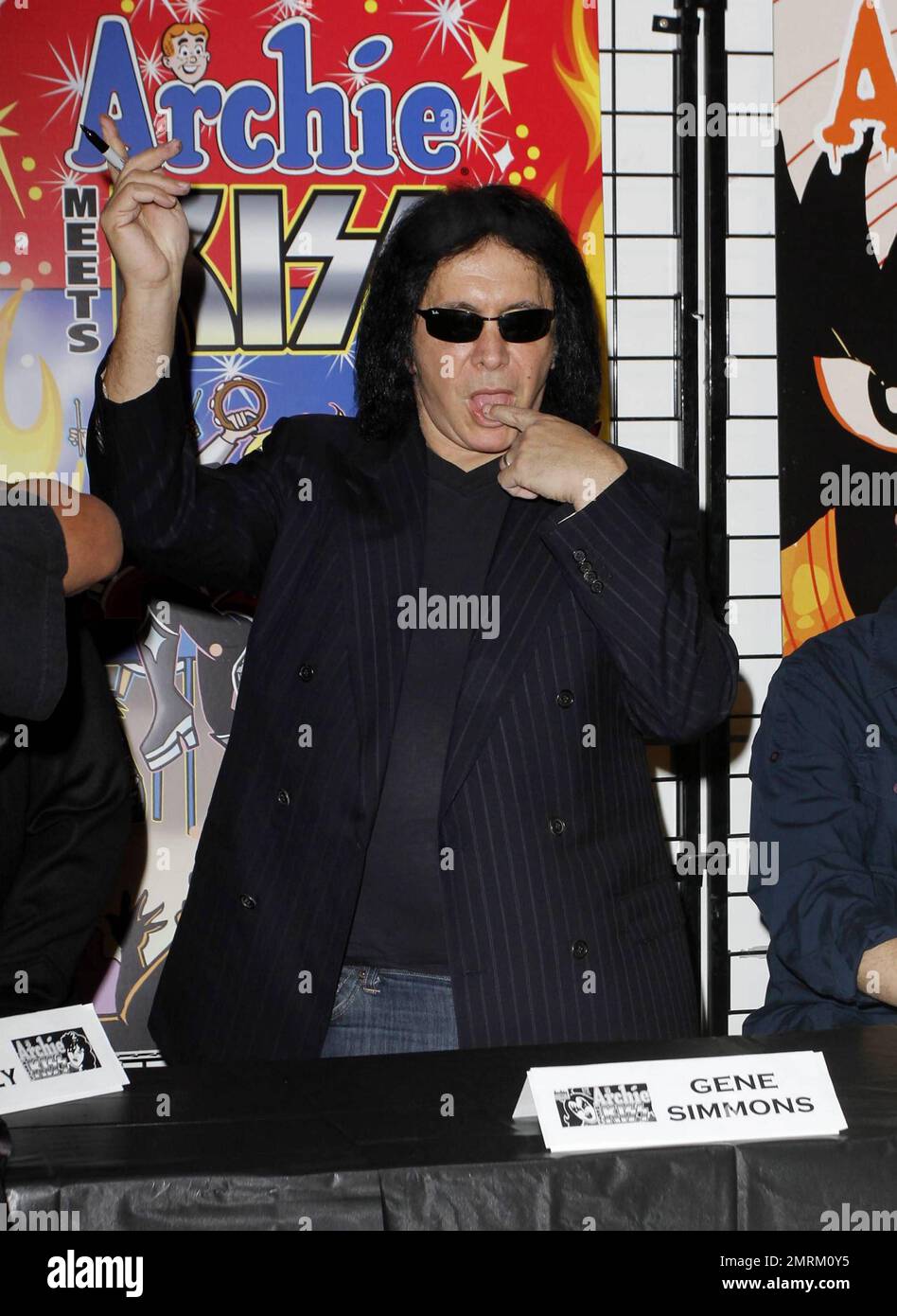 Gene Simmons and Paul Stanley sign copies of "Archie Meets Kiss Part 1 ...