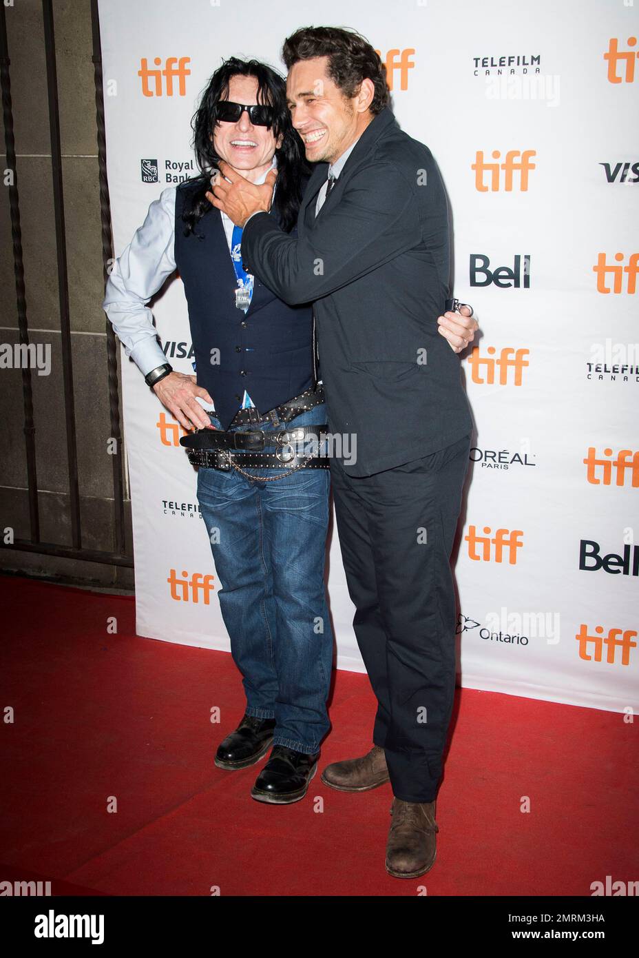 Tommy Wiseau, left, and James Franco attend a premiere for "The ...