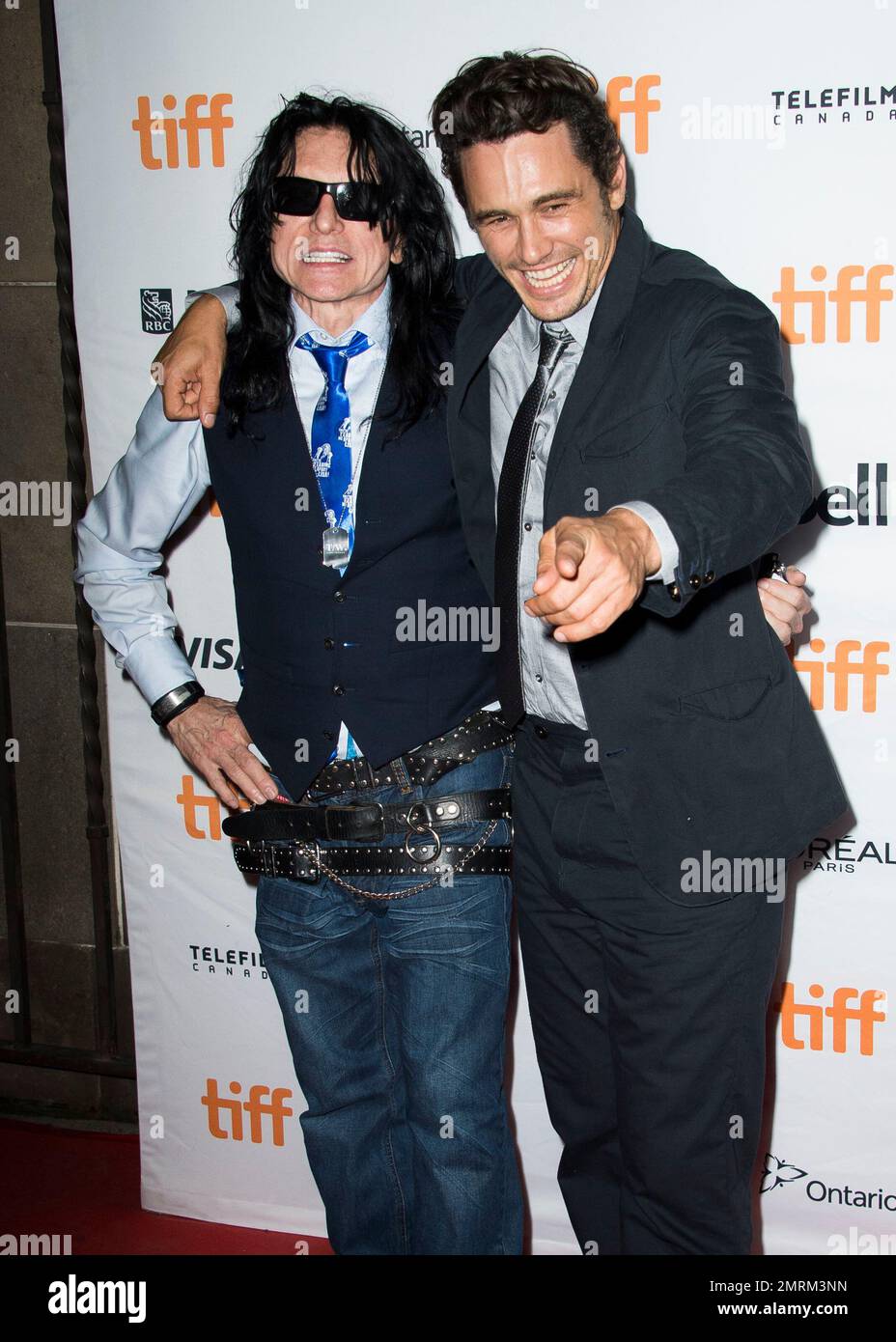 Tommy Wiseau, left, and James Franco attend a premiere for "The ...