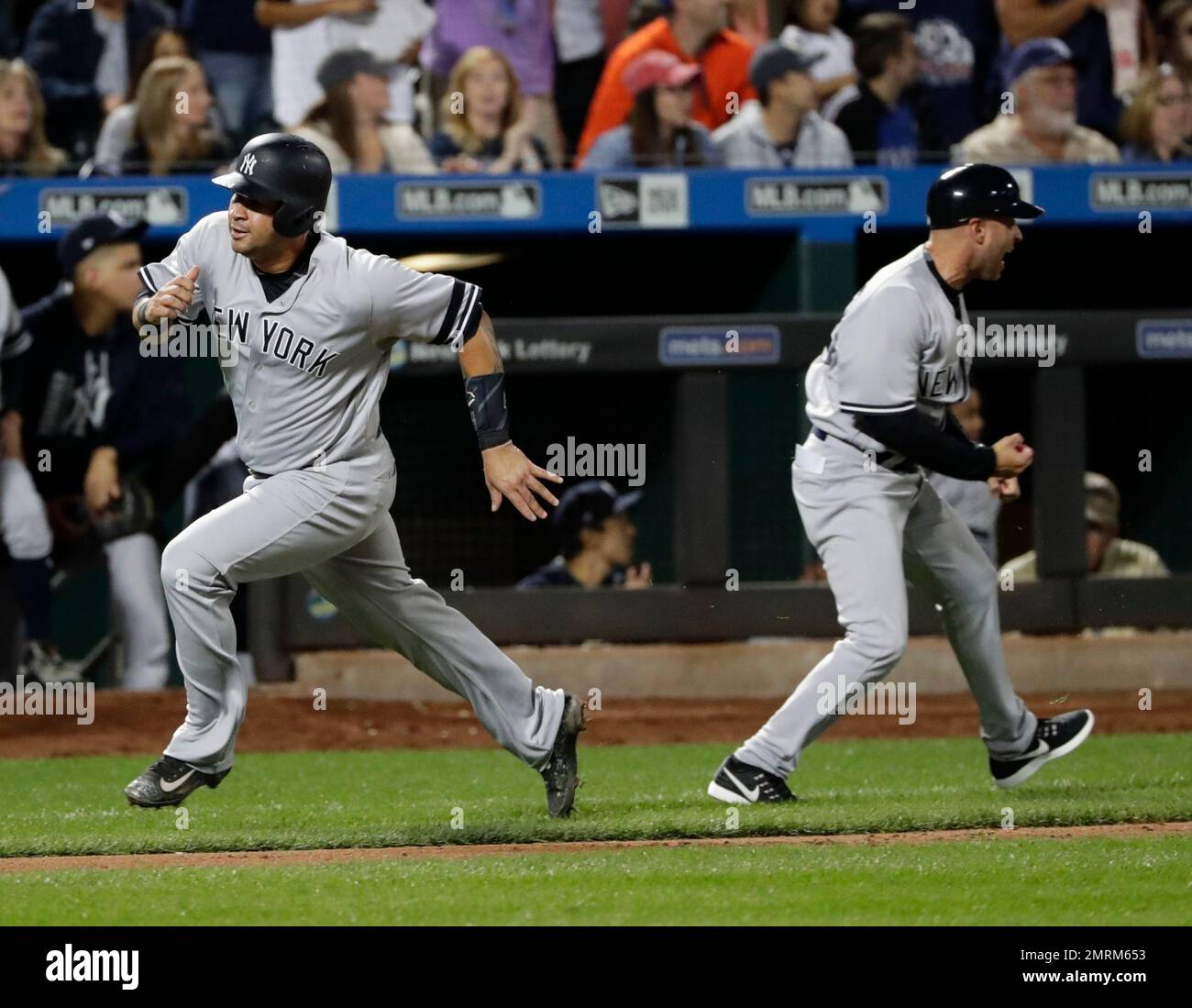 New York Yankees Gary Sanchez, left, runs past third base coach Joe ...