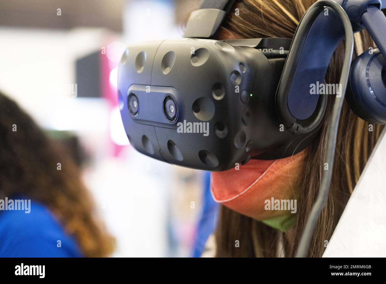 A closeup of a HTC Vive virtual reality headset worn by a girl Stock ...