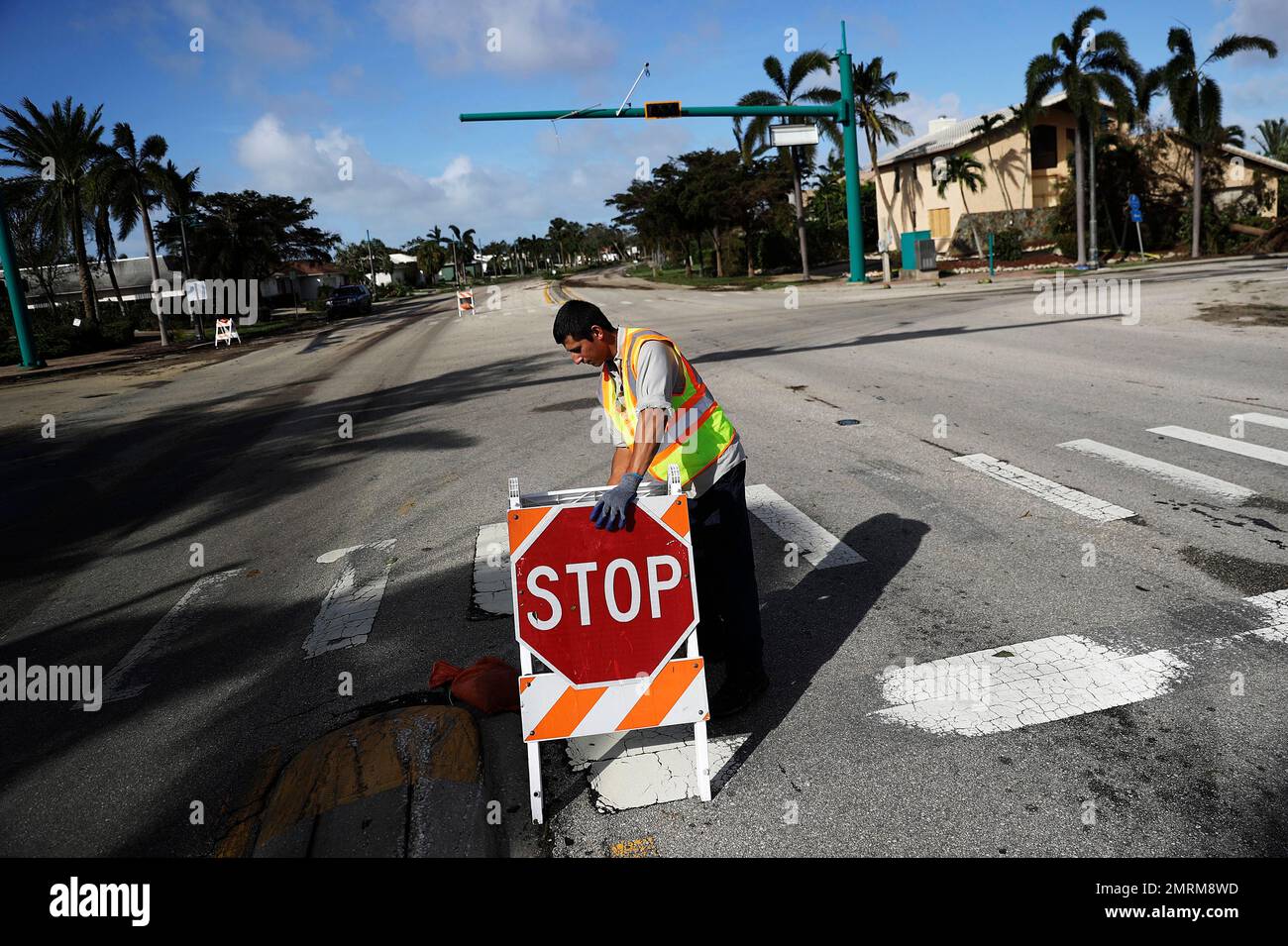 Fidencio Mireles places stop signs at intersections after Hurricane ...