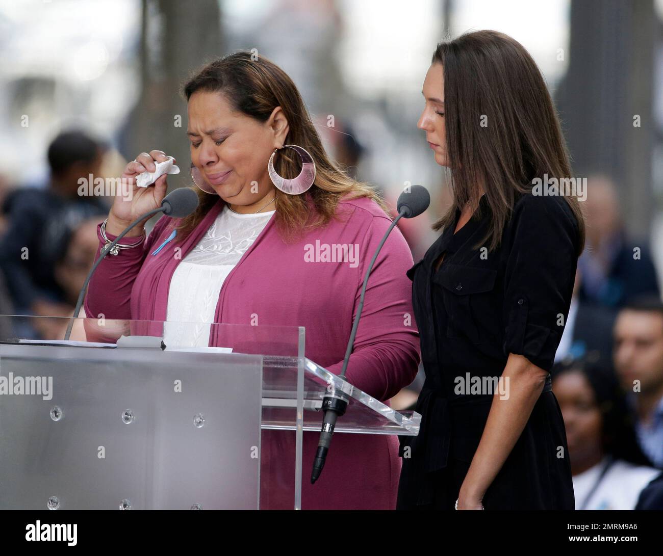 As Nicole Martin, right, looks on, Magaly Lemagne becomes emotional as ...