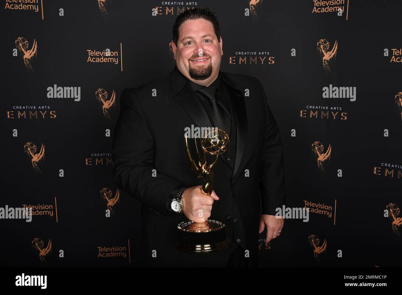 EXCLUSIVE - Dean Zimmerman poses for a portrait with the award for ...