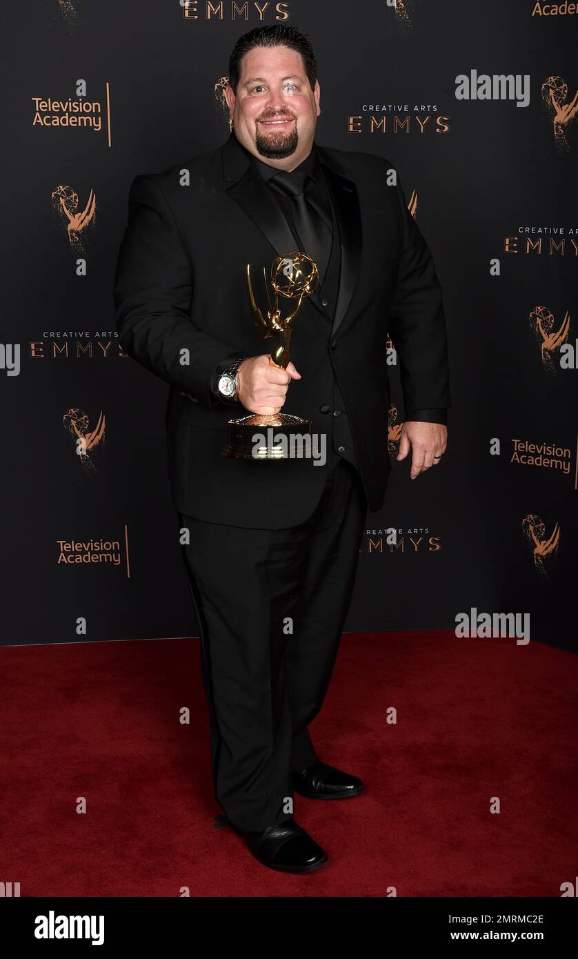 EXCLUSIVE - Dean Zimmerman poses for a portrait with the award for ...
