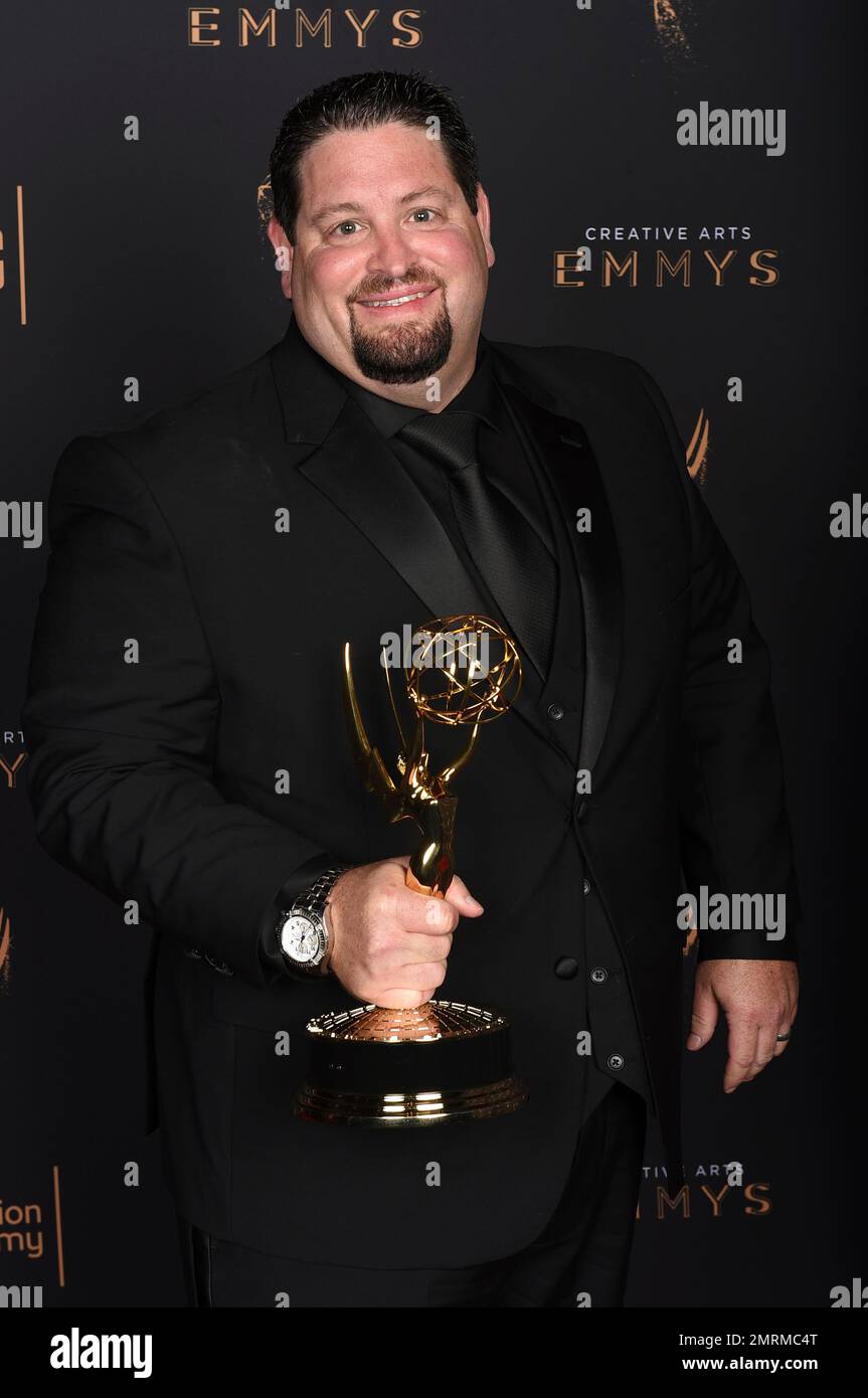 EXCLUSIVE - Dean Zimmerman poses for a portrait with the award for ...