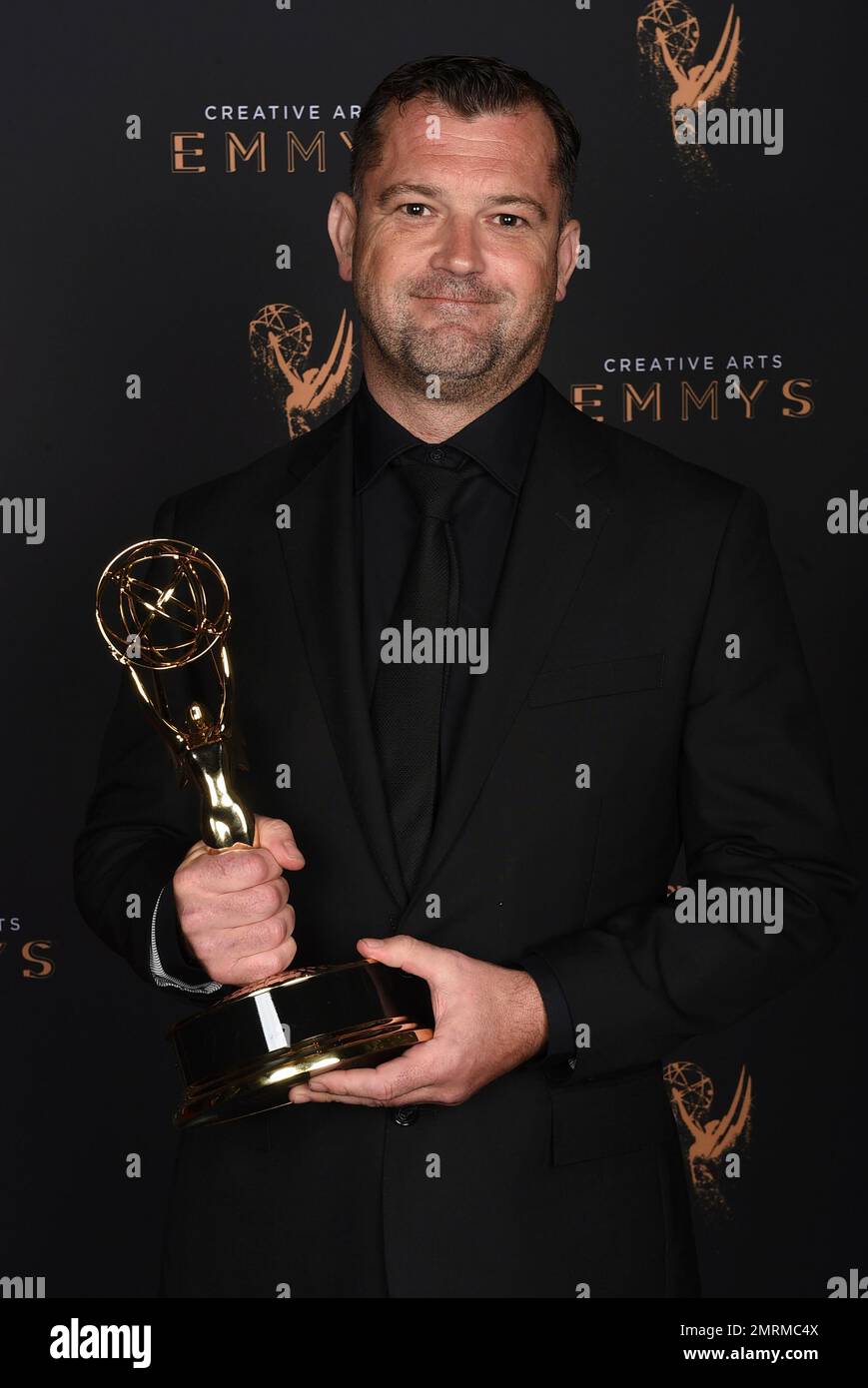 EXCLUSIVE - Colin Watkinson poses for a portrait with the award for ...