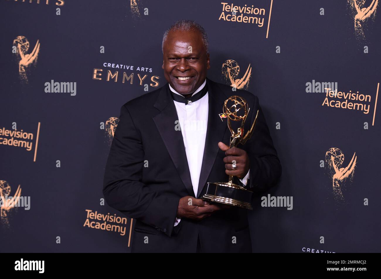 Kim Estes poses in the press room with accepts the award for ...