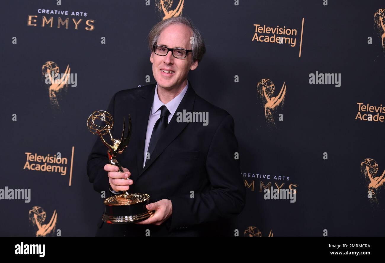 Jeff Beal poses in the press room with the award for outstanding music ...