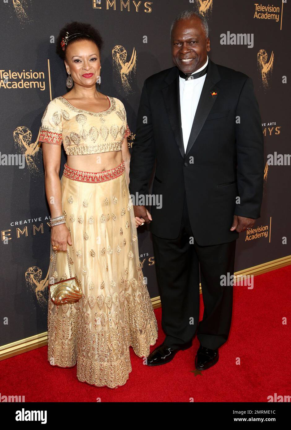 Kim Estes, right, arrives at night two of the Television Academy's 2017 ...