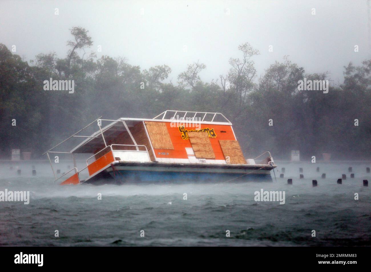 A floundered boat is shown at the Haulover Marine Center at Haulover ...