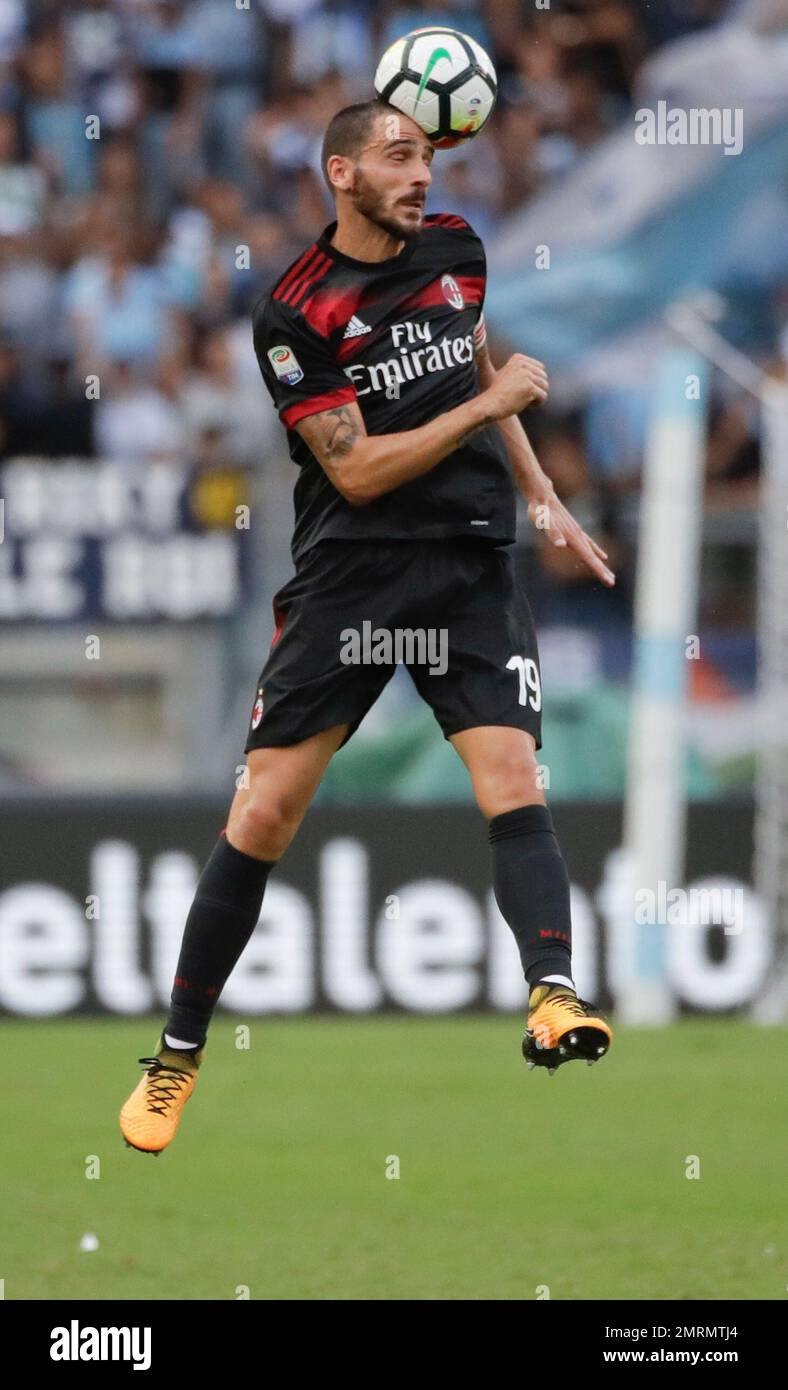 AC Milan's Leonardo Bonucci heads the ball during a Serie A soccer match between Lazio and AC ...