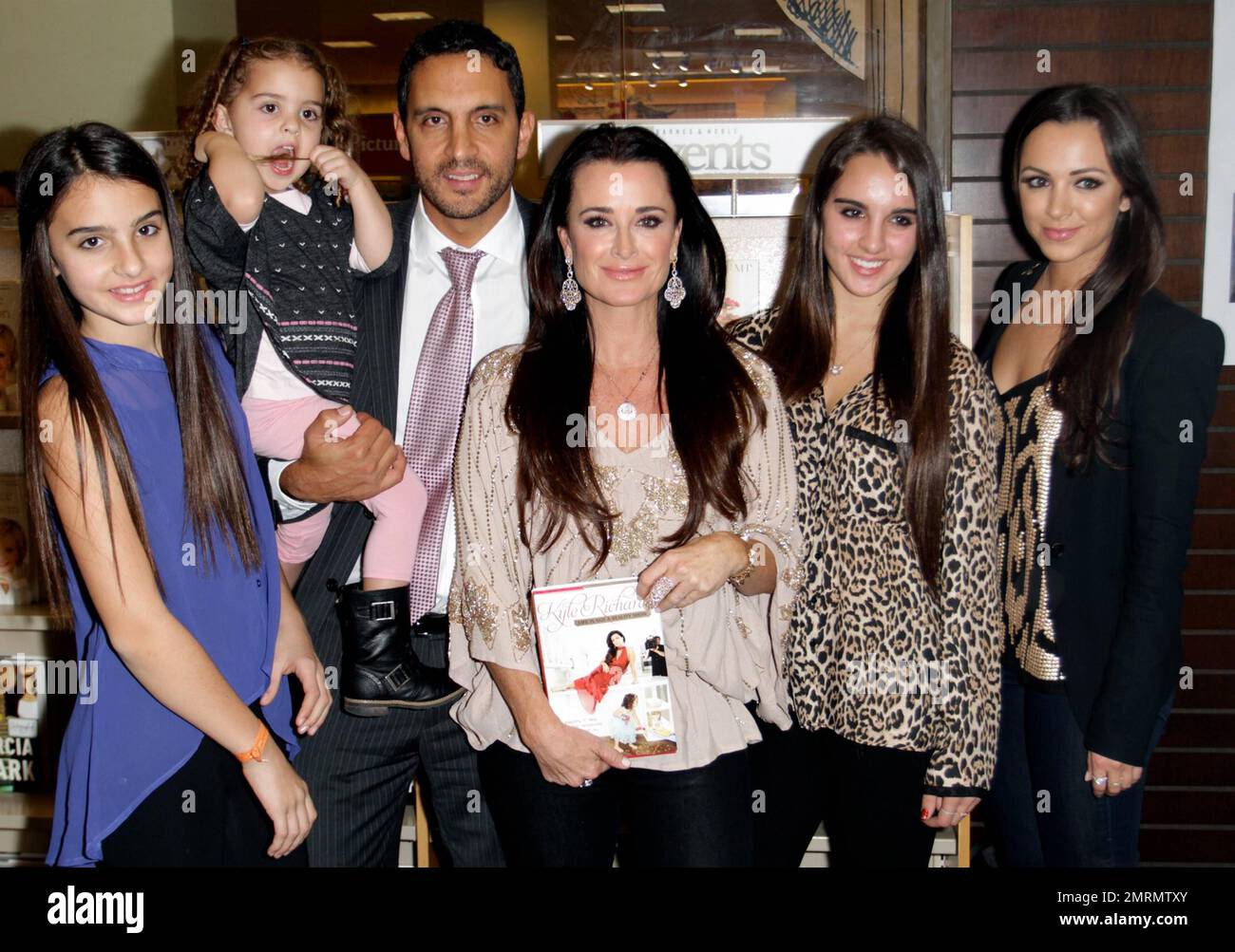 TV personality Kyle Richards (center) and family at a book signing ...