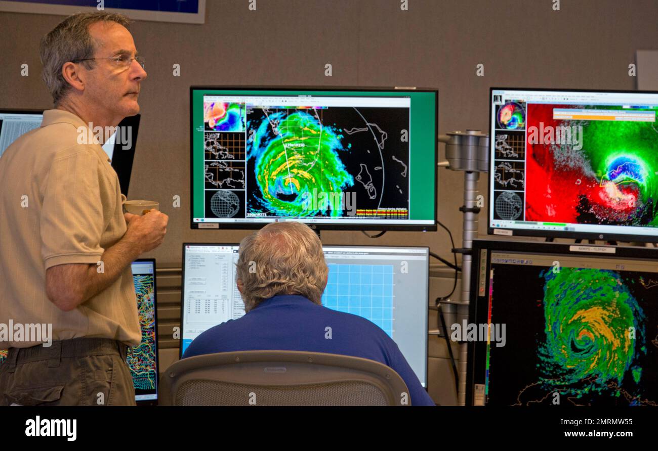 National Hurricane Center Acting Director Ed Rappaport, left, and ...