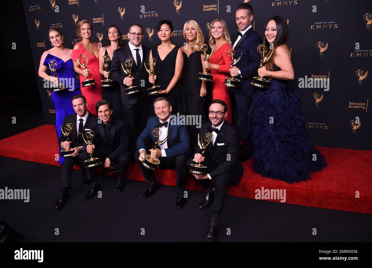 The team from "Shark Tank" poses in the press room with the award for ...
