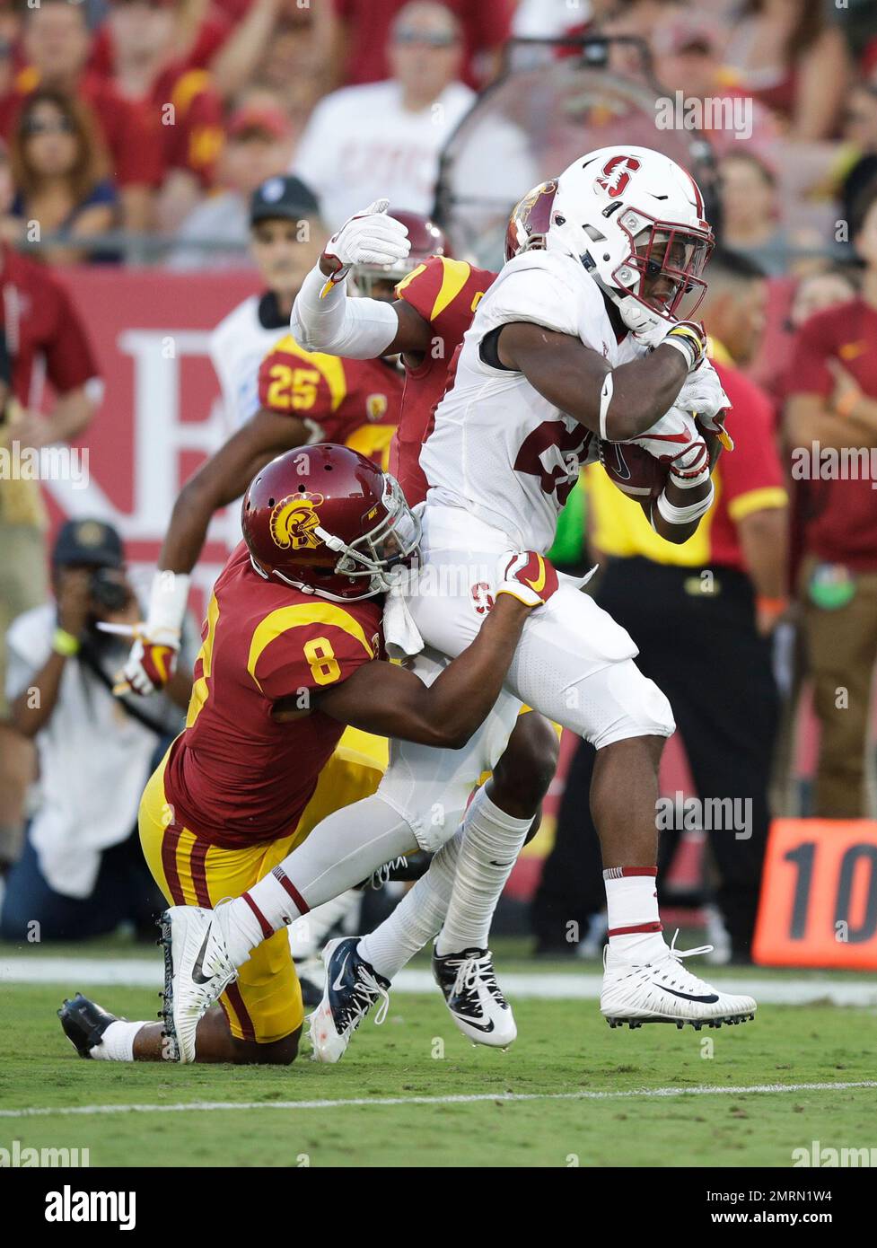 Stanford running back Bryce Love, right, is grabbed by Southern ...