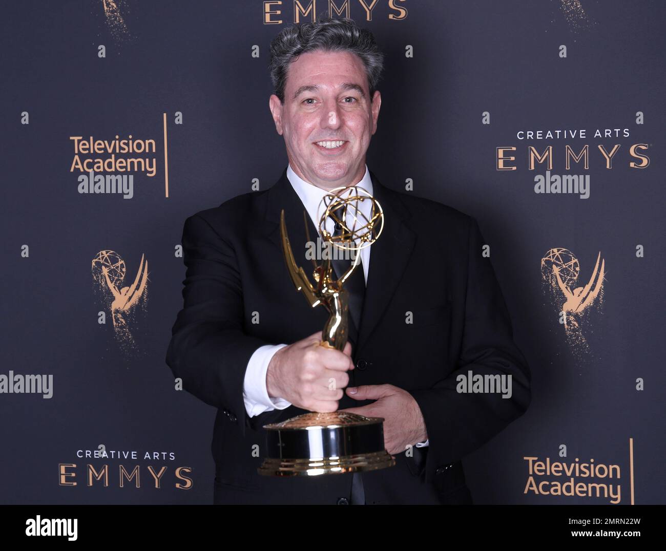 EXCLUSIVE - Lou Romano poses for a portrait with the award for ...