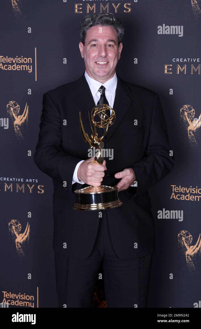 EXCLUSIVE - Lou Romano poses for a portrait with the award for ...