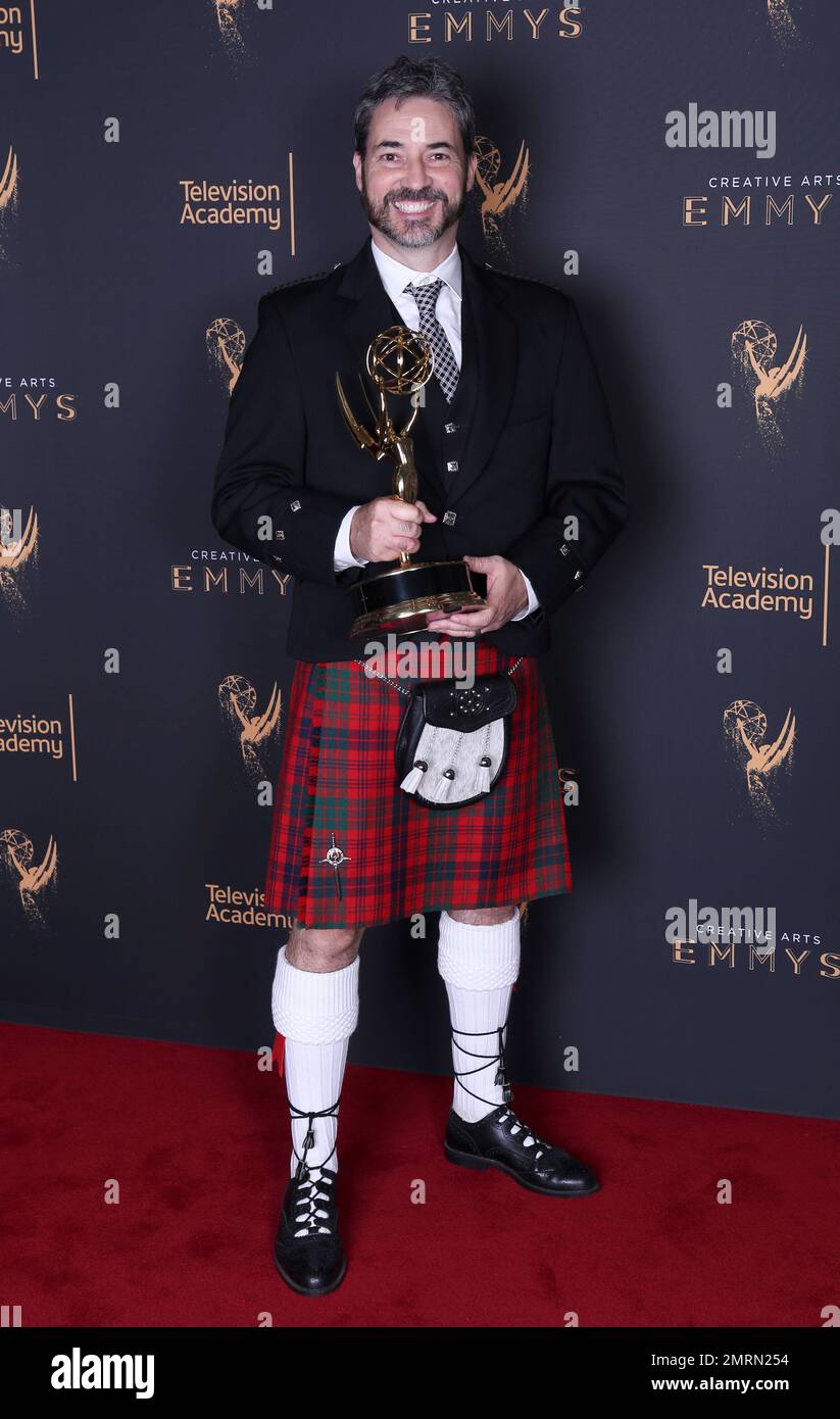 EXCLUSIVE - Bryan Andrews poses for a portrait with the award for ...