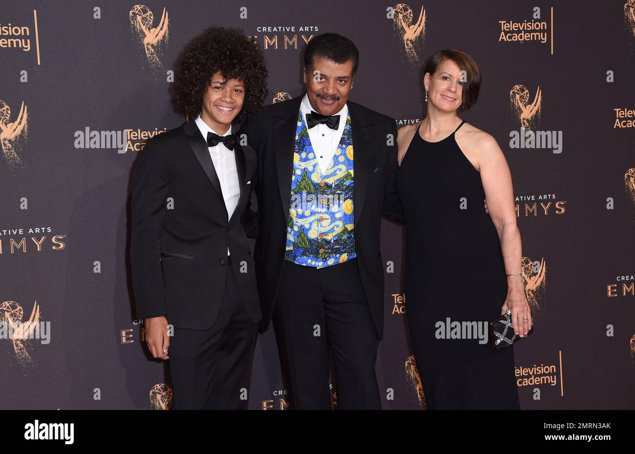 Travis Tyson, from left, Neil deGrasse Tyson, and Alice Young arrive at ...
