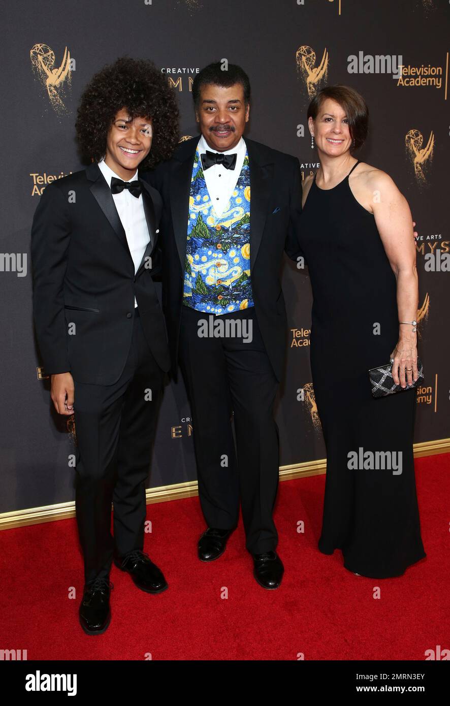 Travis Tyson, from left, Neil deGrasse Tyson, and Alice Young arrive at ...
