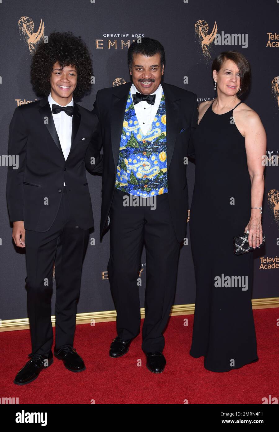 Travis Tyson, from left, Neil deGrasse Tyson, and Alice Young arrive at ...