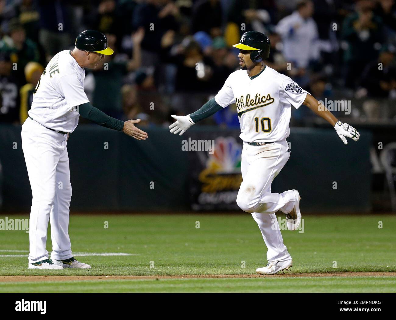 Oakland Athletics' Marcus Semien, right, is congratulated by third base ...