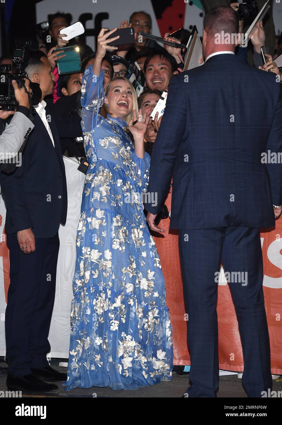 Margot Robbie takes a selfie with fans at a premiere for "I, Tonya" on ...