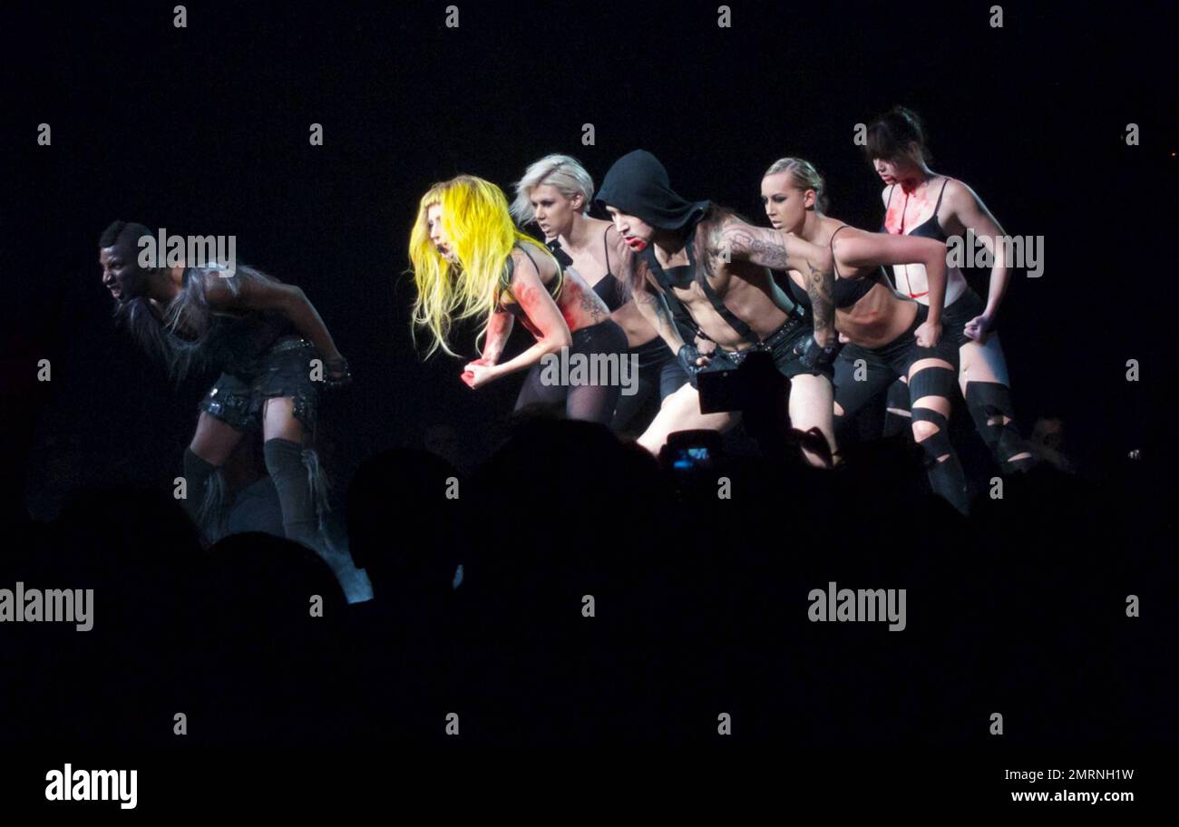 Performing with her backup dancers Lady Gaga belts out her tunes and ...