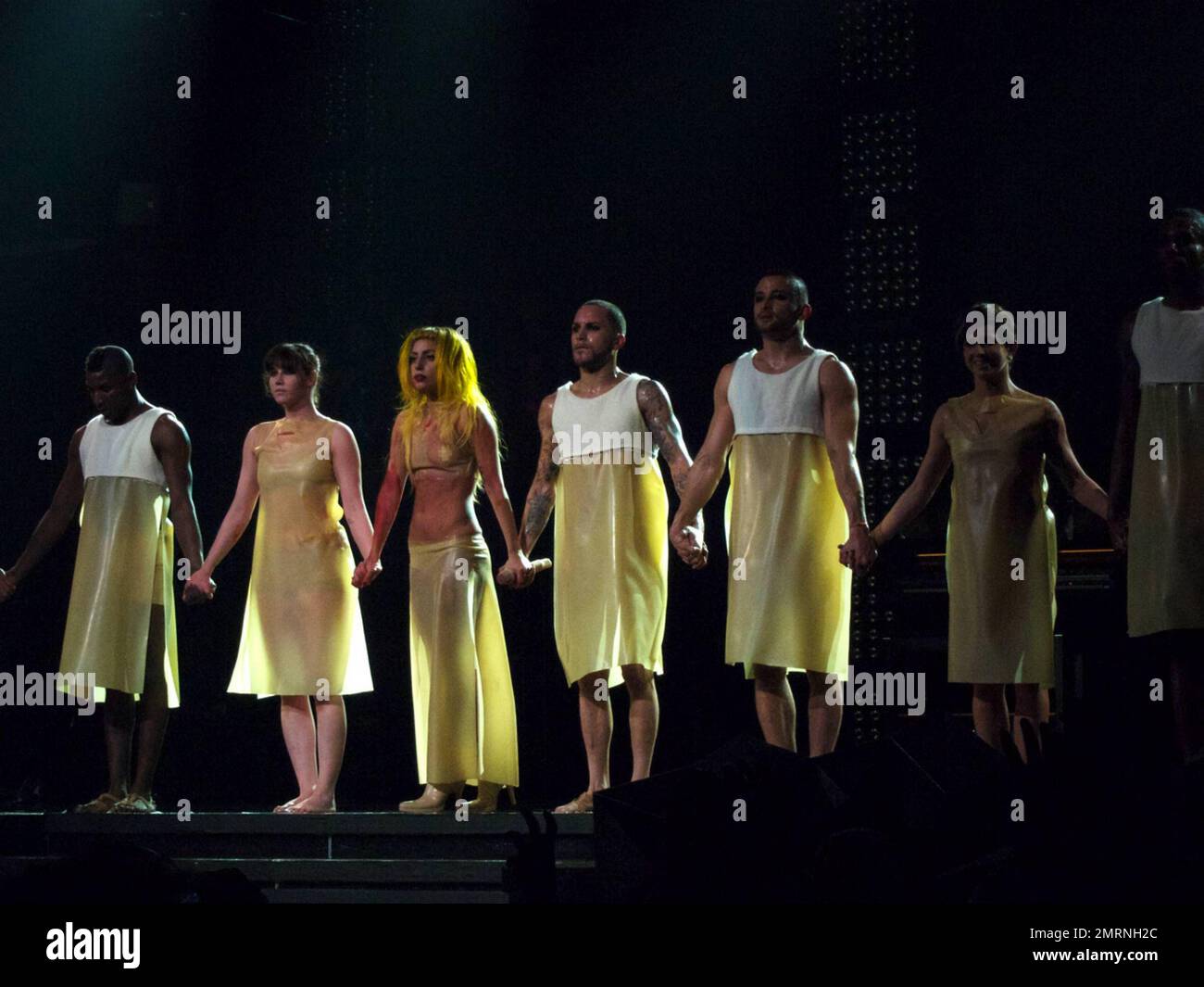 Performing with her backup dancers Lady Gaga belts out her tunes and ...