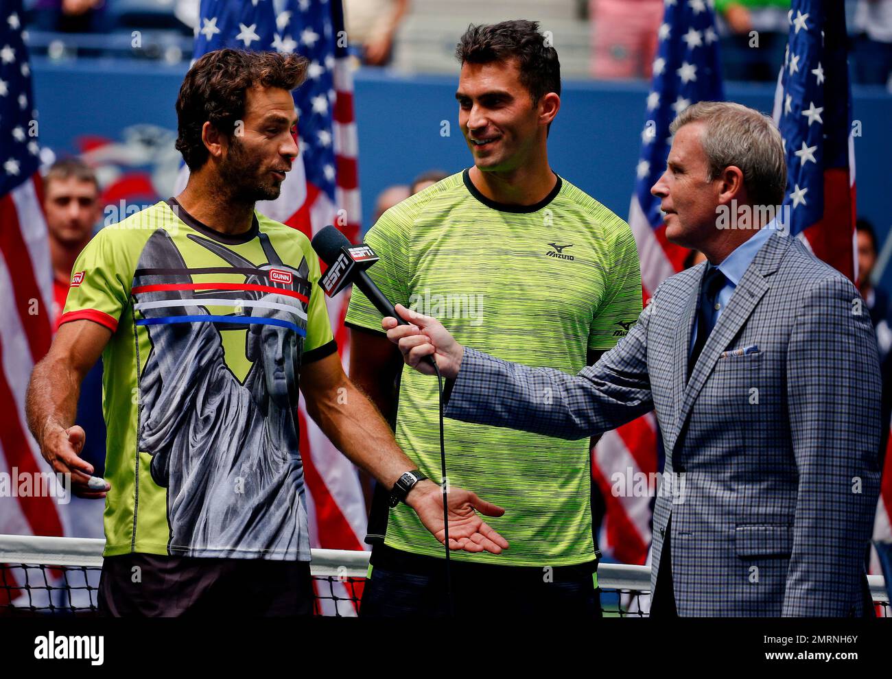 Dutch tennis player Jean-Julien Rojer, left, talks with ESPN reporter ...
