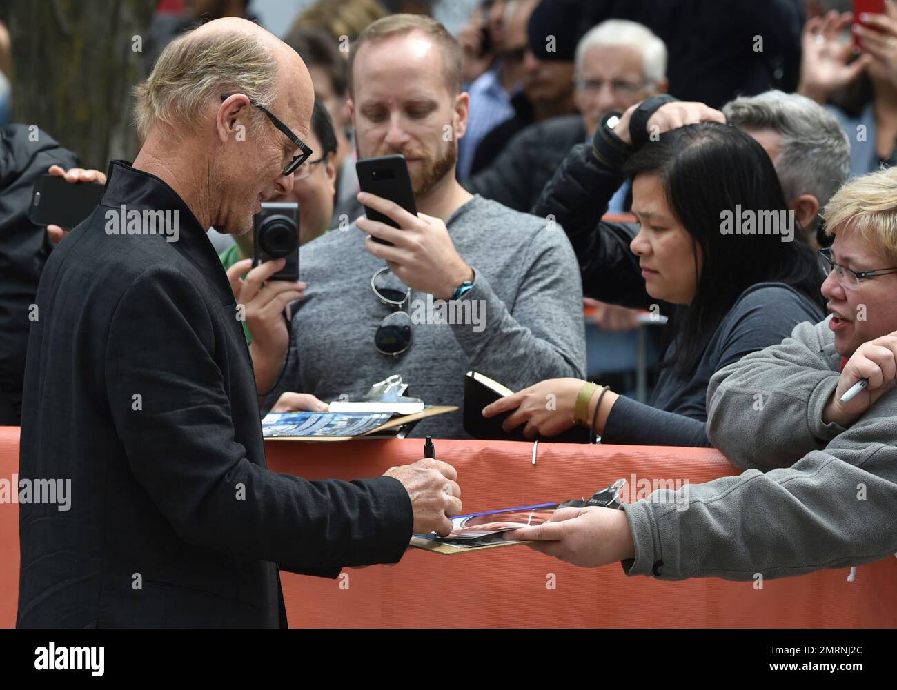 Ed Harris signs autographs as he attends a premiere for "Kodachrome" on ...