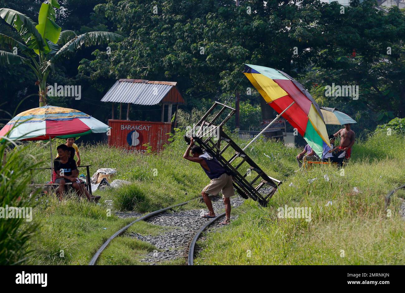 A driver carries his improvised cart locally known as "Trolleys" to ...