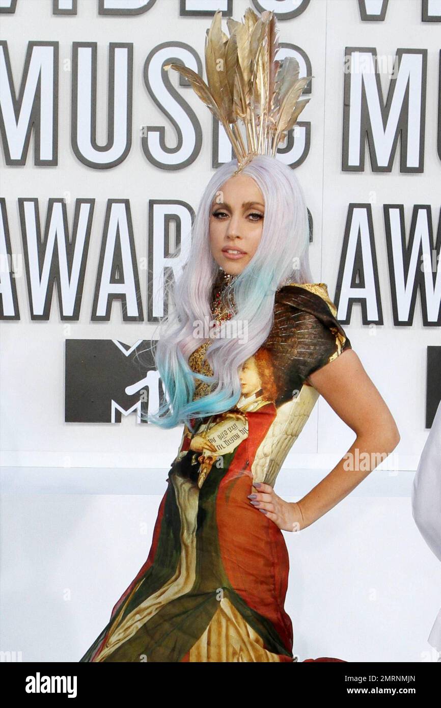 Global pop star Lady Gaga arrives in a patterned tulle gown and gold ...