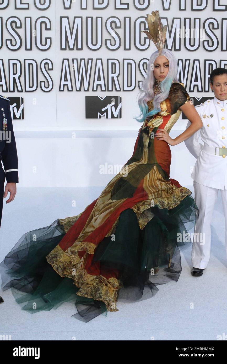 Global pop star Lady Gaga arrives in a patterned tulle gown and gold ...