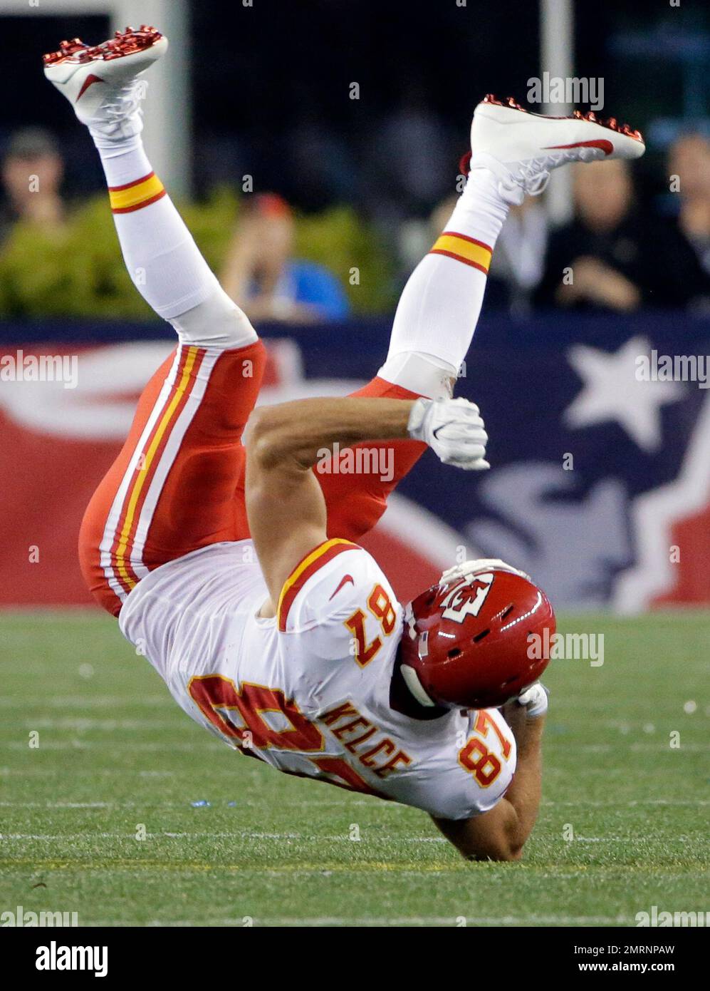 Kansas City Chiefs tight end Travis Kelce hits the turf after being ...