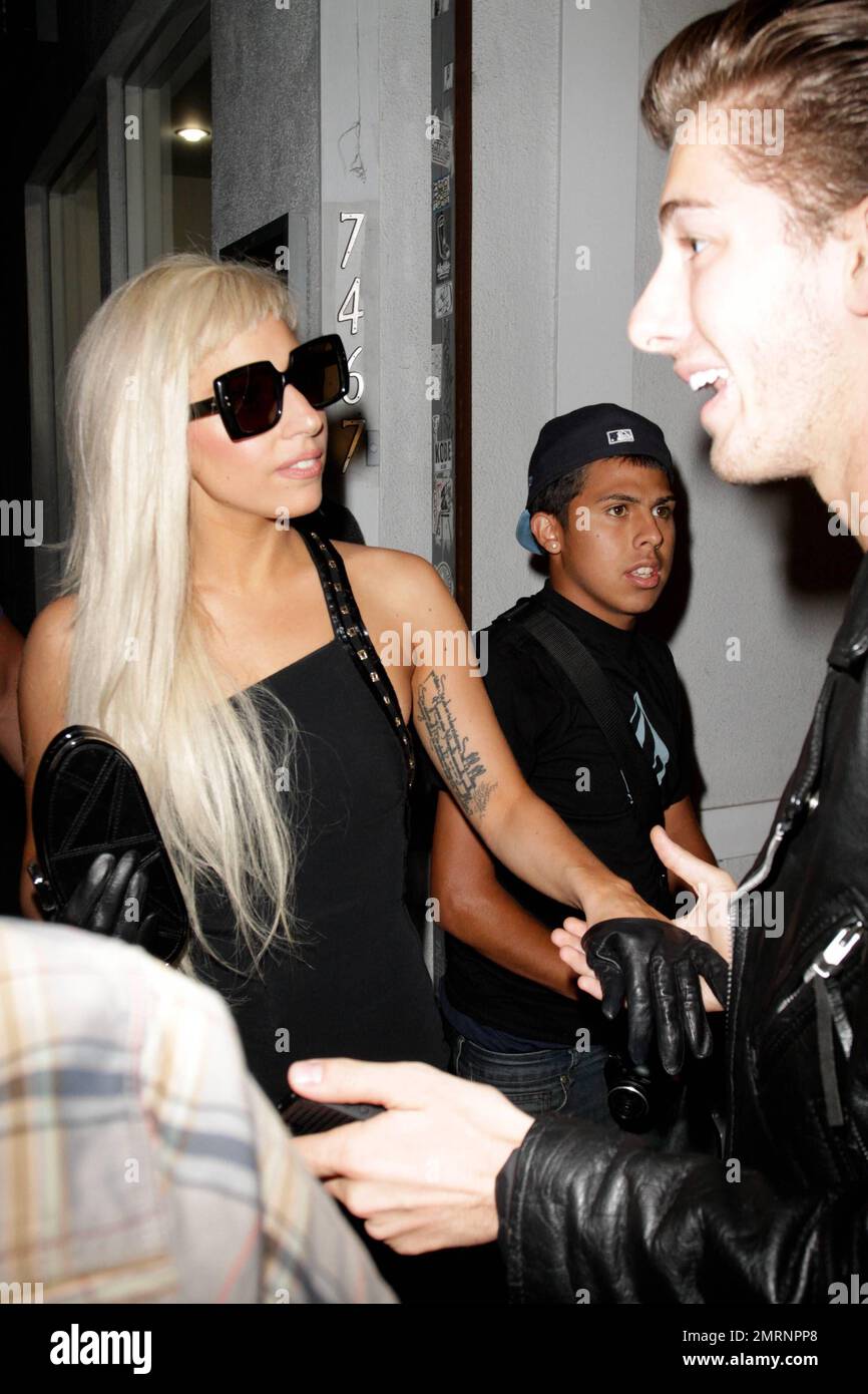 Lady Gaga greets fans, signing autographs and hugging some as she ...