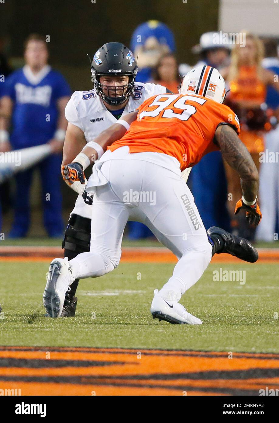 Tulsa offensive tackle Evan Plagg (66) blocks Oklahoma State defensive ...