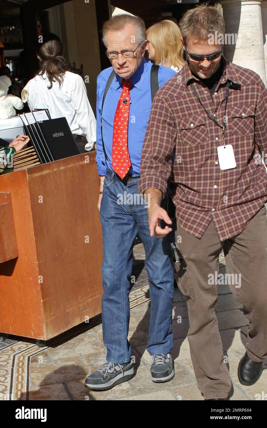 TV personality Larry King wears his trademark suspenders while out at ...