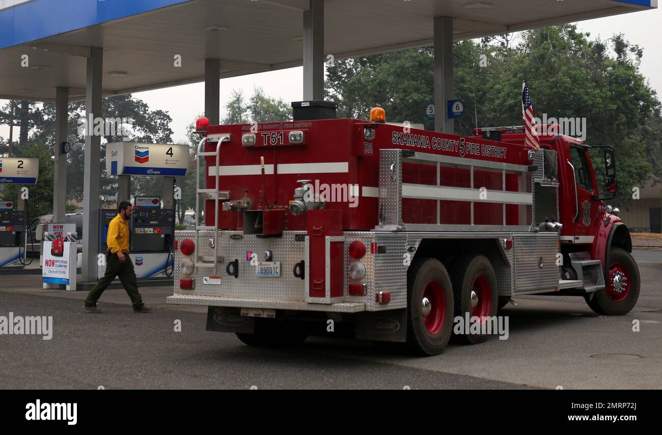 Kyle Brown, with Skamania County Fire District 5, fuels a fire truck in ...