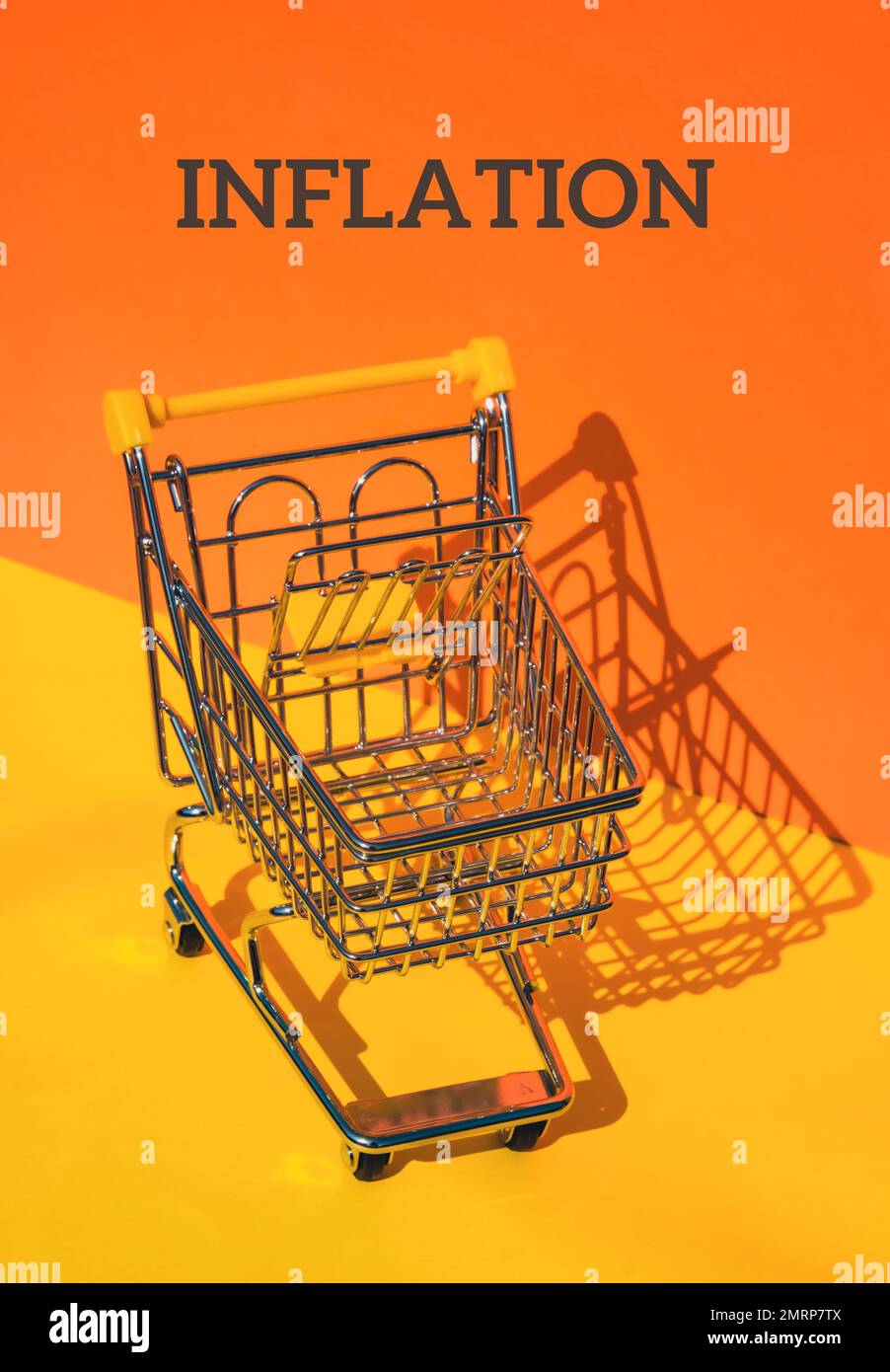 INFLATION text against Empty shopping trolley cart on isometric orange ...