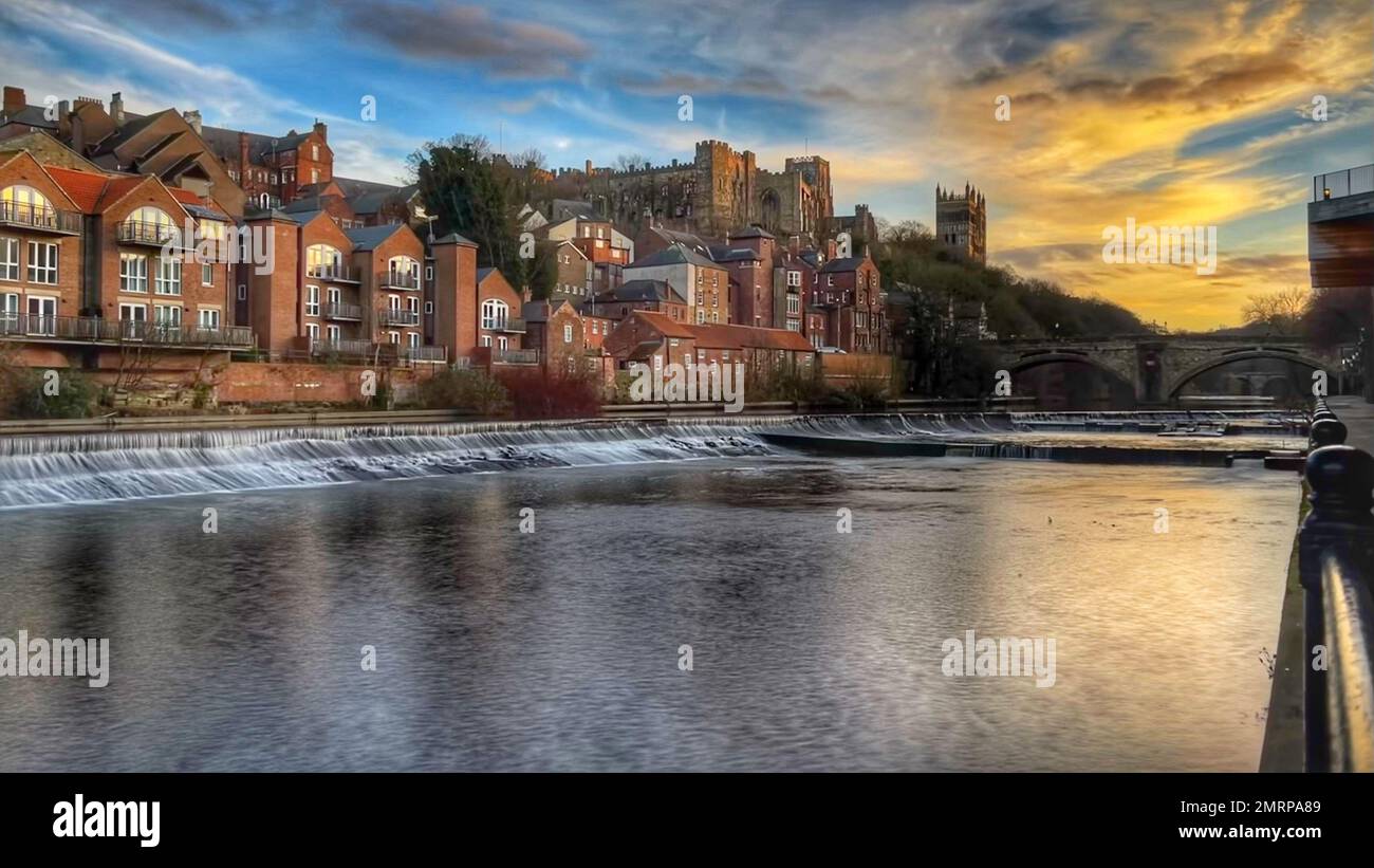 A river and traditional buildings of Durham, City in the UK during ...