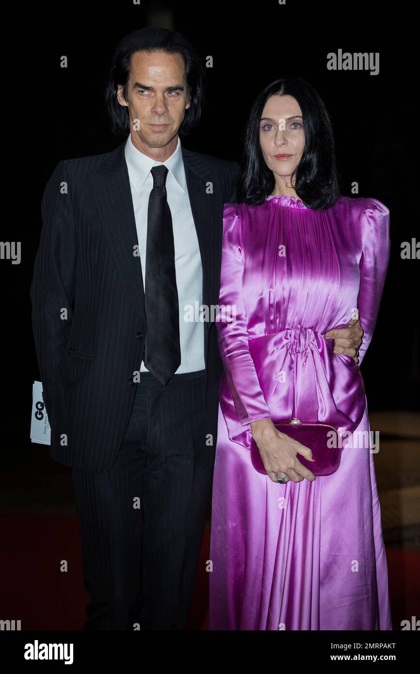 Nick Cave and Susie Bick pose for photographers upon arrival at the GQ ...