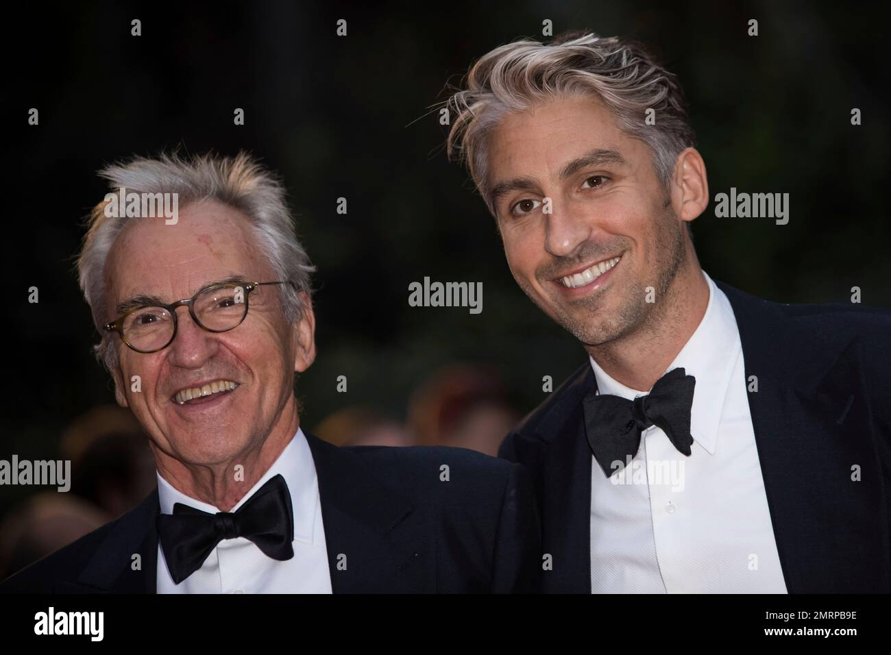 Larry Lamb and George Lamb pose for photographers upon arrival at the ...