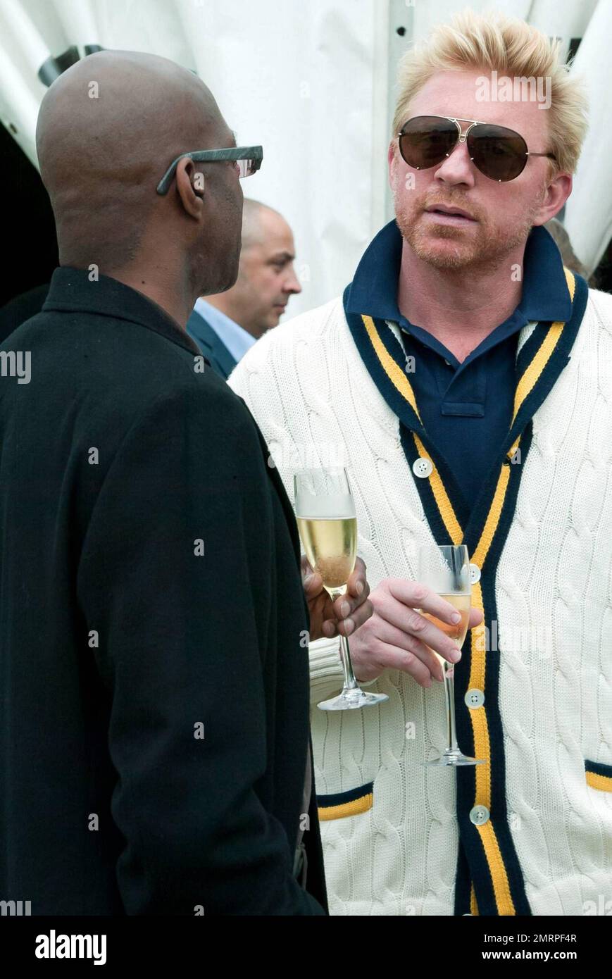 Boris Becker talks to Edwin Moses while attending the Laureus Polo Cup ...