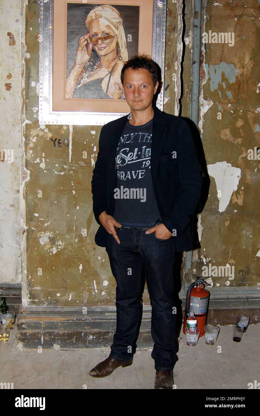 Johnny Yeo attends the Lazarides Gallery event and stands in front of ...