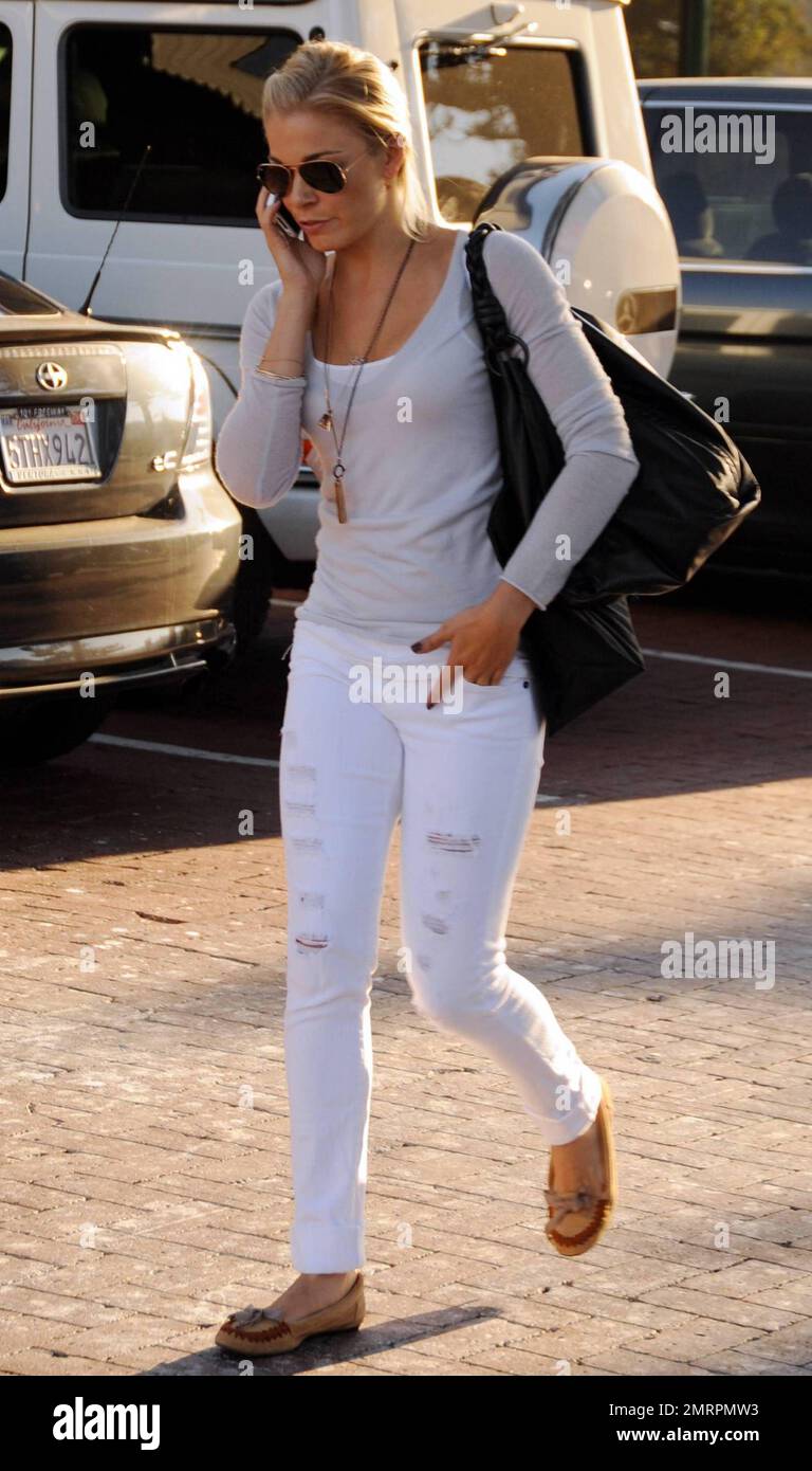 Dressed casually in a grey top and white jeans, LeAnn Rimes gets in a day of shopping in Malibu ...