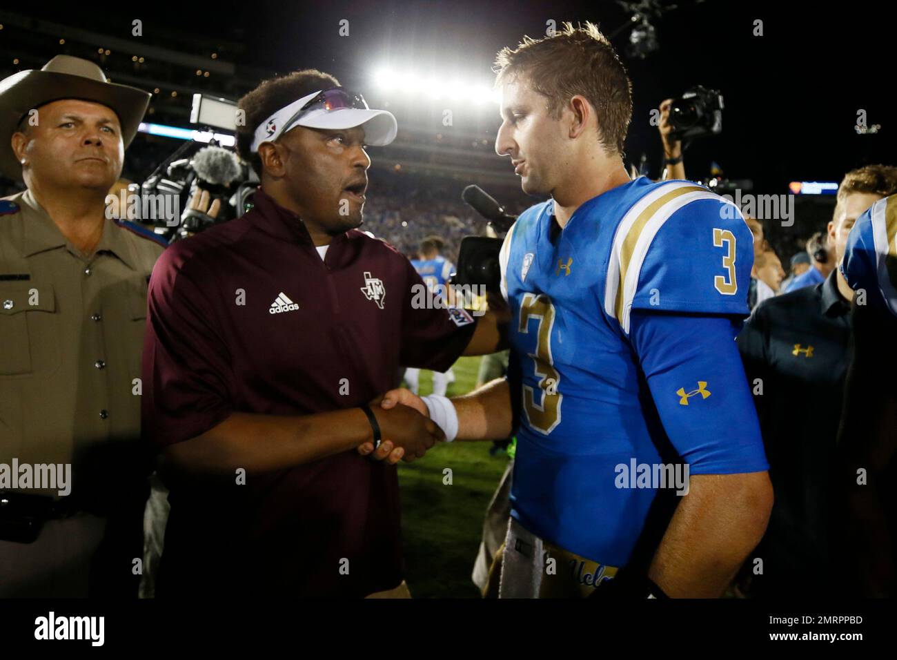 UCLA quarterback Josh Rosen, right, and Texas A&M head coach Kevin ...