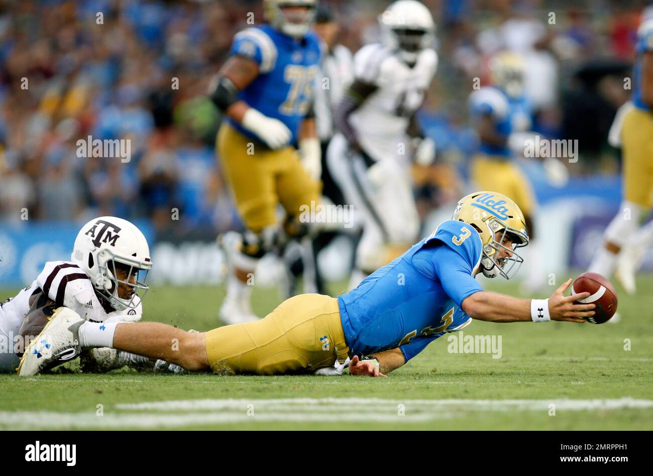 UCLA quarterback Josh Rosen, right, is sacked by Texas A&M linebacker ...